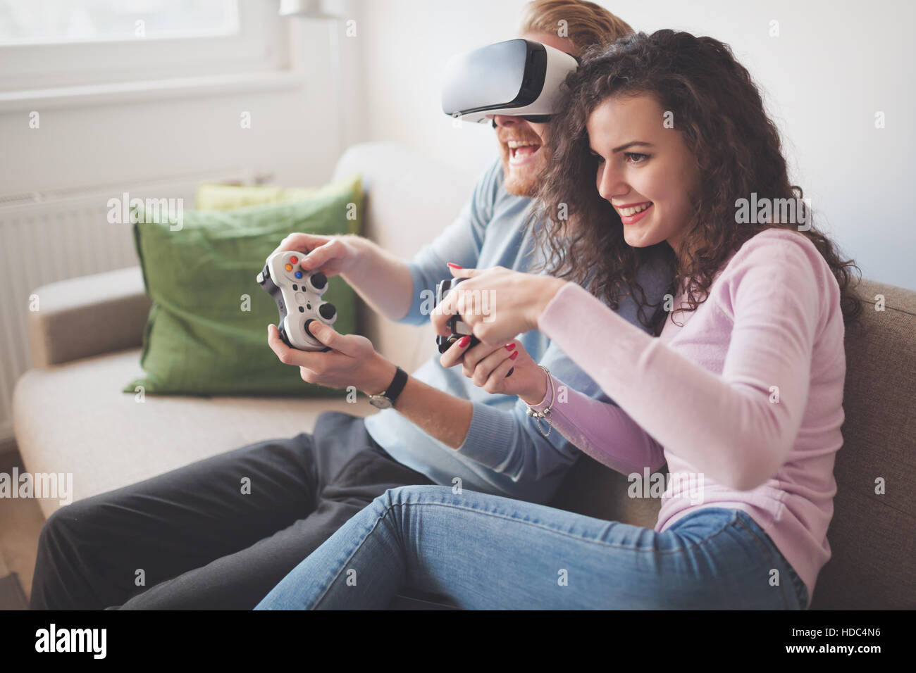 Couple having fun playing with virtual reality Stock Photo - Alamy