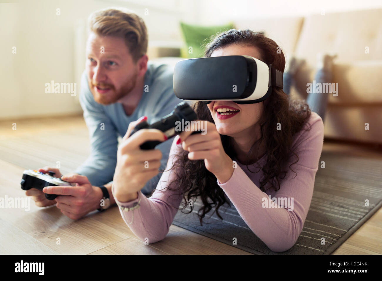 Couple having fun playing with virtual reality Stock Photo - Alamy