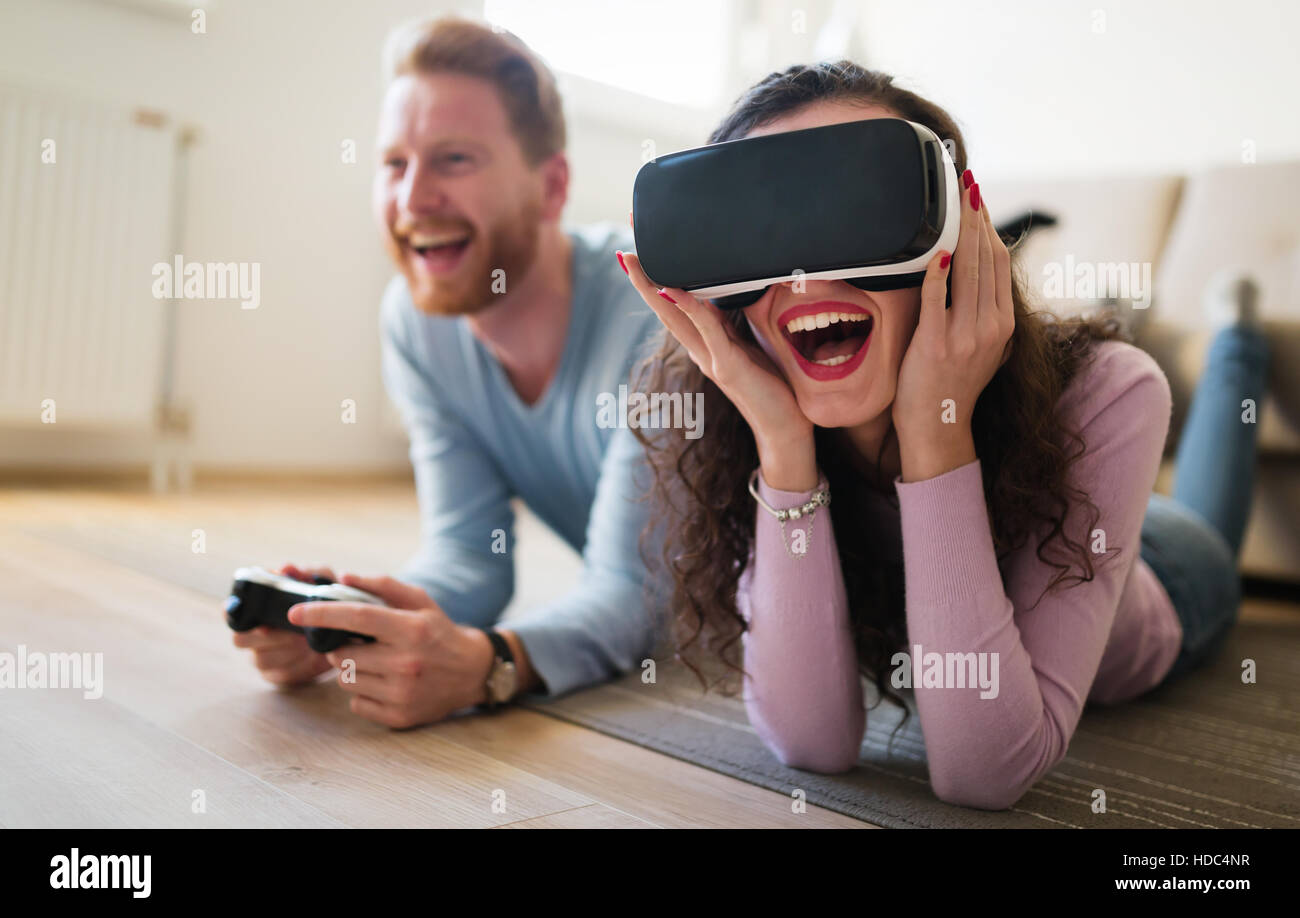 Couple having fun playing with virtual reality Stock Photo - Alamy