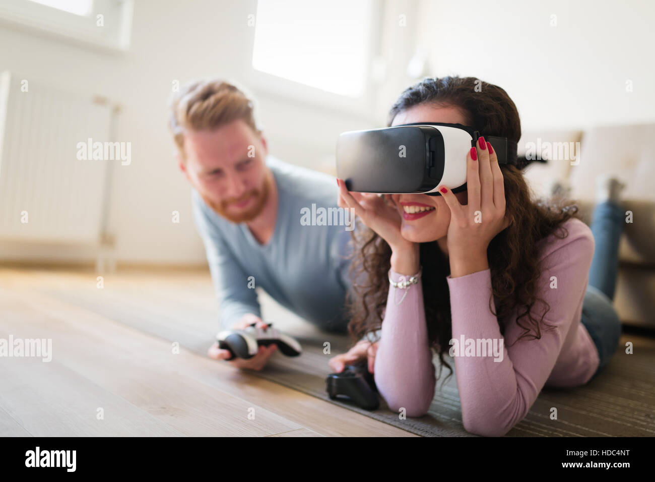 Couple playing games and loving VR as future tech Stock Photo - Alamy