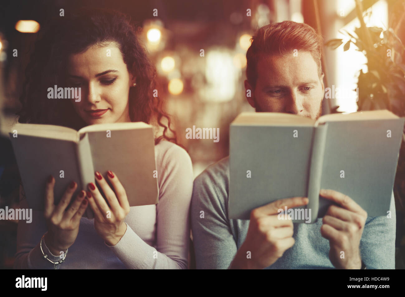 Young university students reading books and studying Stock Photo - Alamy