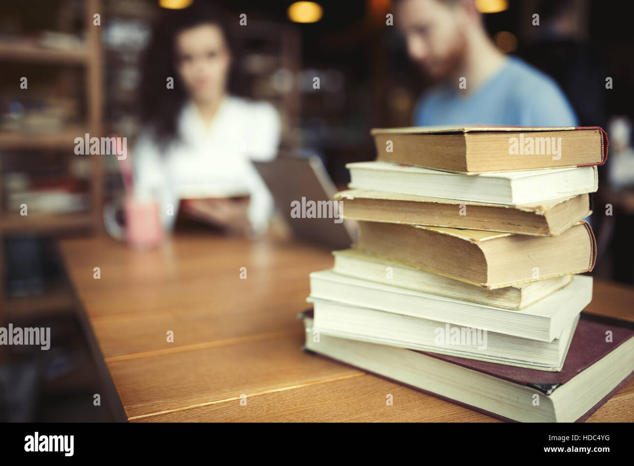 Young students studying in library for exam Stock Photo - Alamy