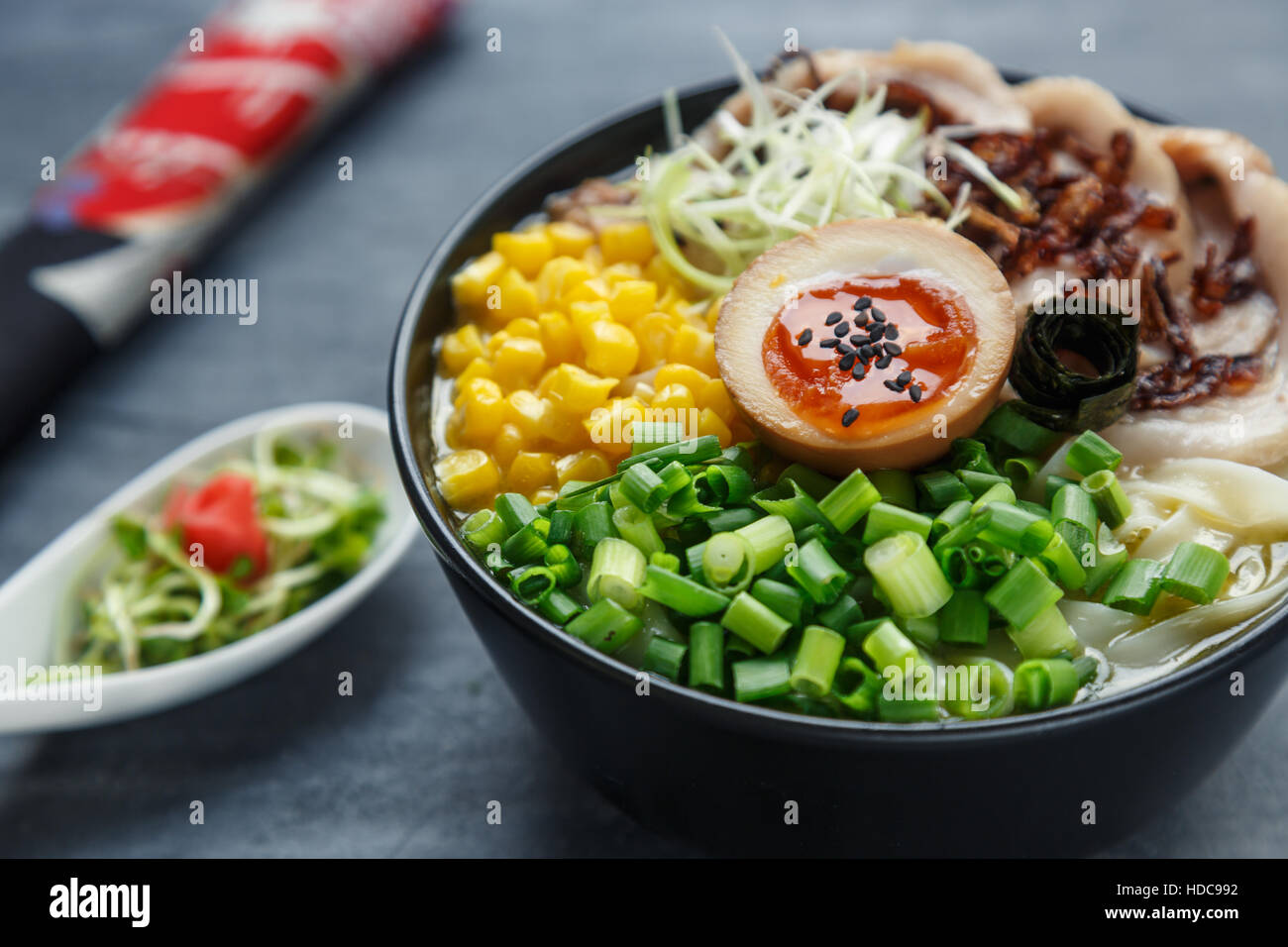 tonkotsu ramen, japanese noodle soup with pork belly, corn, spring ...