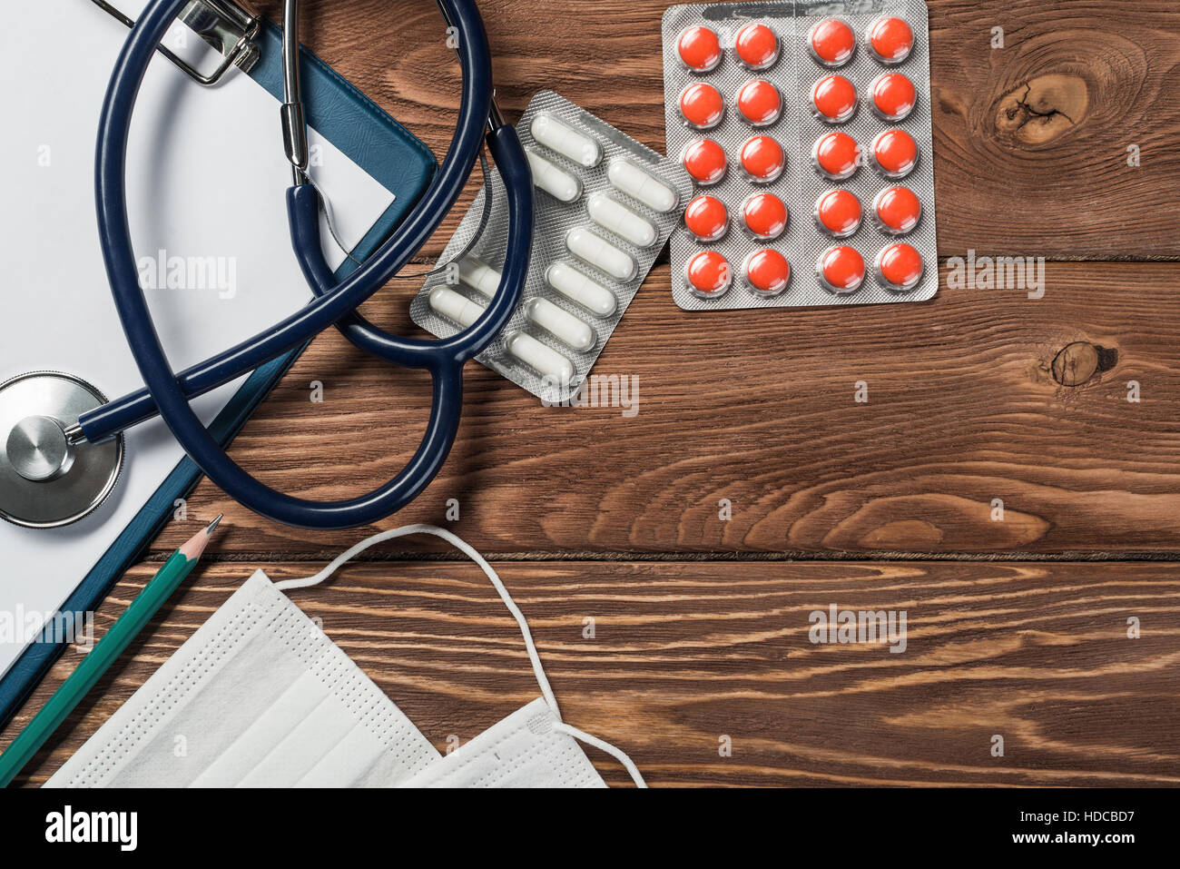 Desk of doctor with medicine things Stock Photo - Alamy