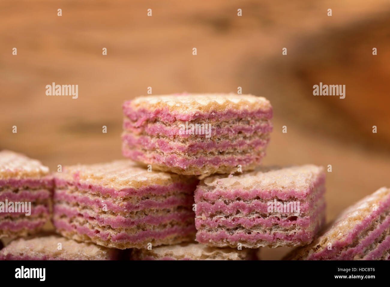 macro wafers stuffed with raspberry cream over wood Stock Photo - Alamy