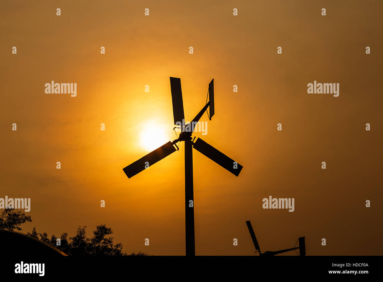 Wind turbine with sun Stock Photo - Alamy
