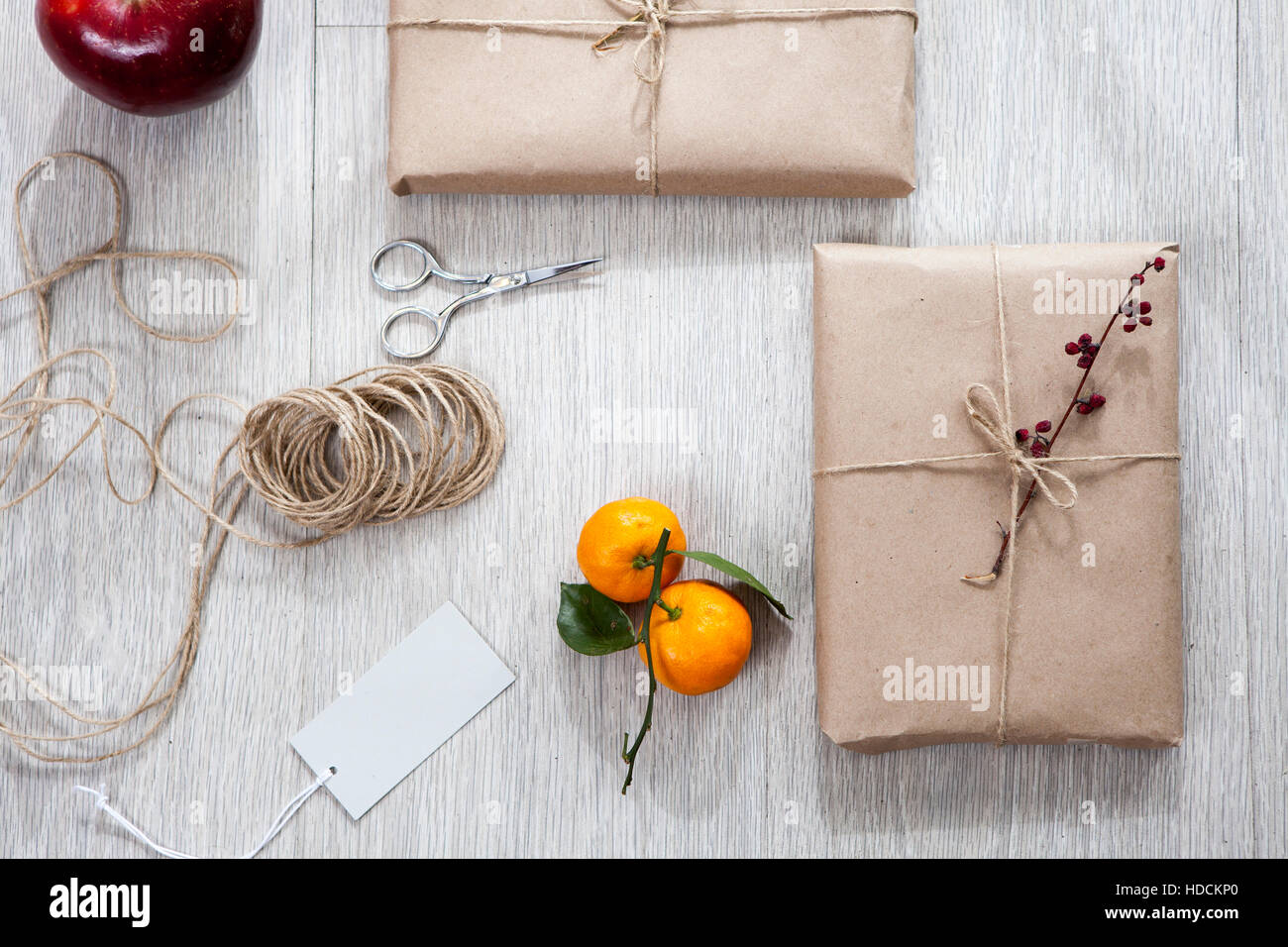 Various items for gift wrapping are on the table. Gifts already packed ...