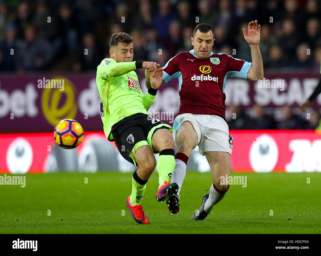 AFC Bournemouth's Ryan Fraser (left) and Burnley's Dean Marney battle ...