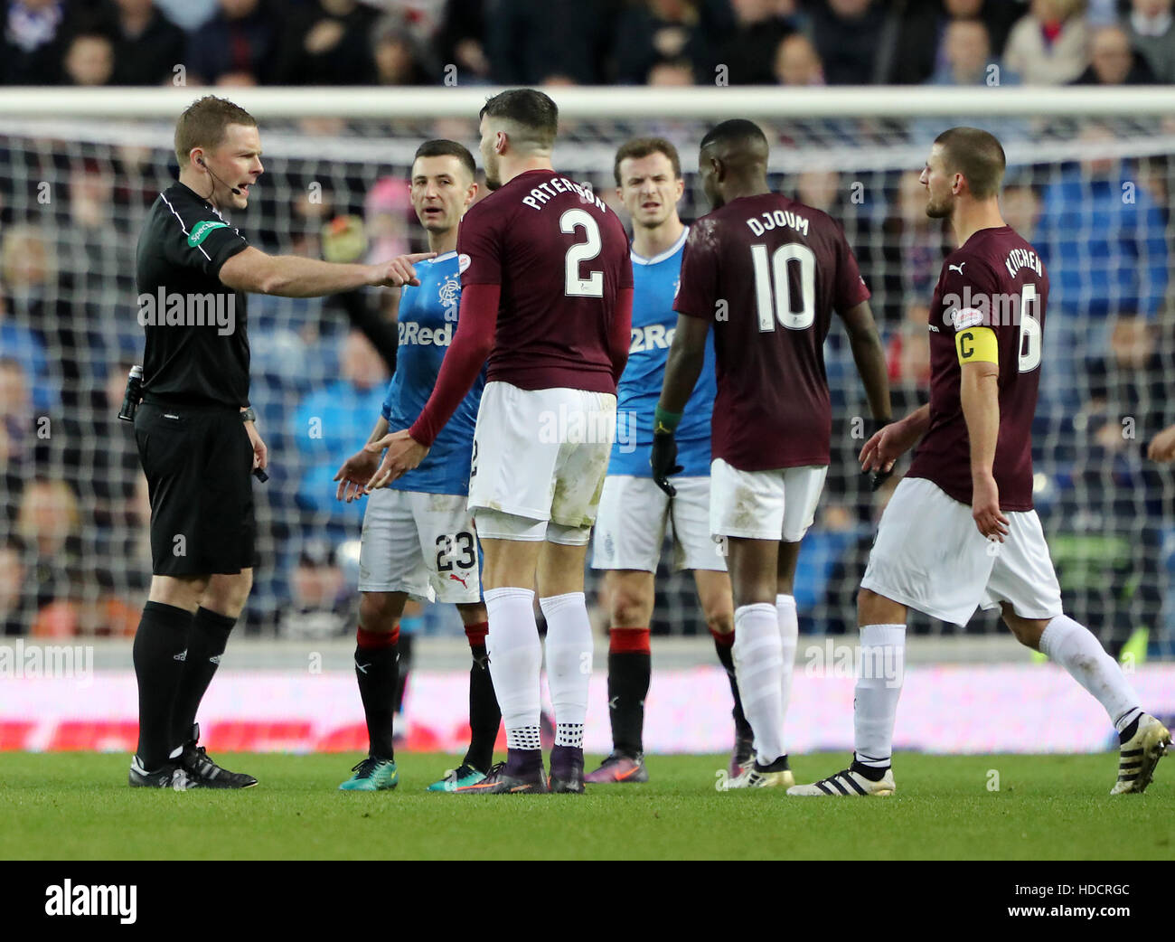 Referee John Beaton (left) talks to Heart of Midlothian's Callum ...