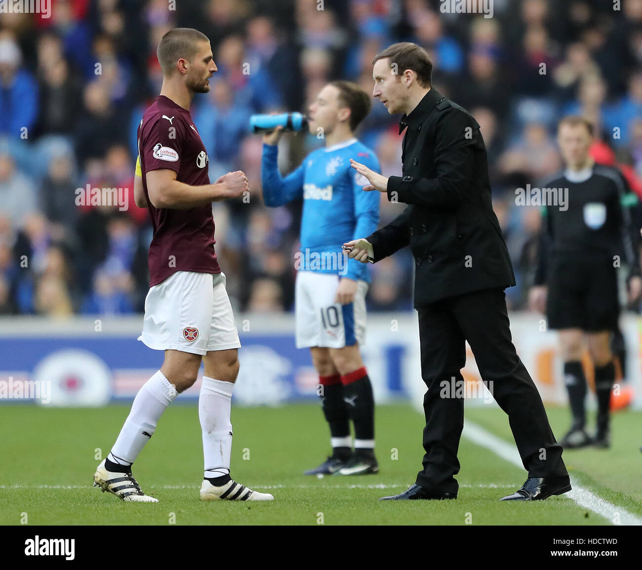 Heart of Midlothian's Perry Kitchen (left) talks to manager Ian Cathro ...