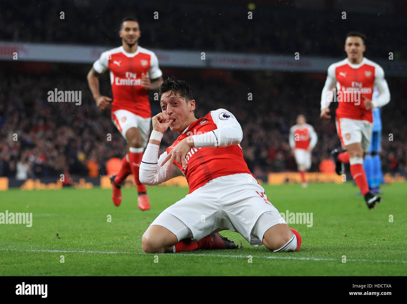 Arsenal's Mesut Ozil celebrates scoring his side's second goal during ...