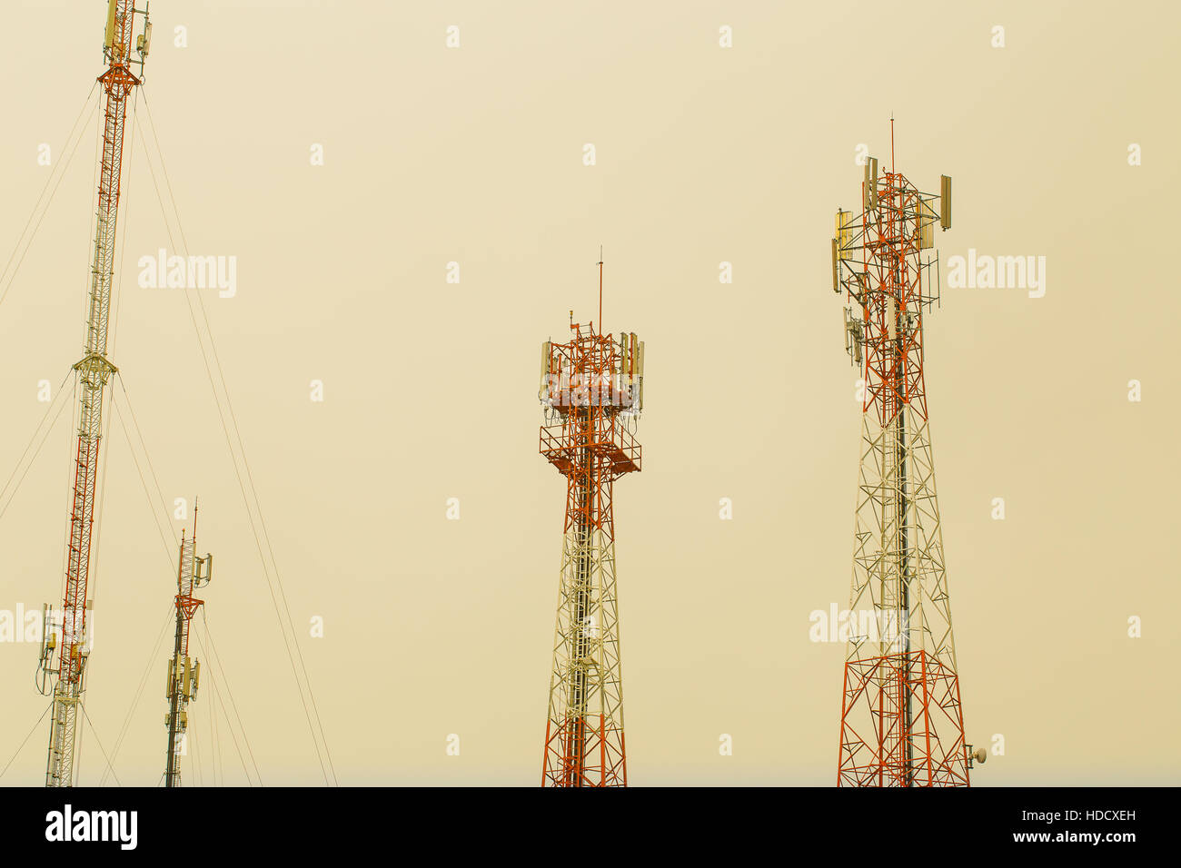 Red and white tower antennas Stock Photo - Alamy