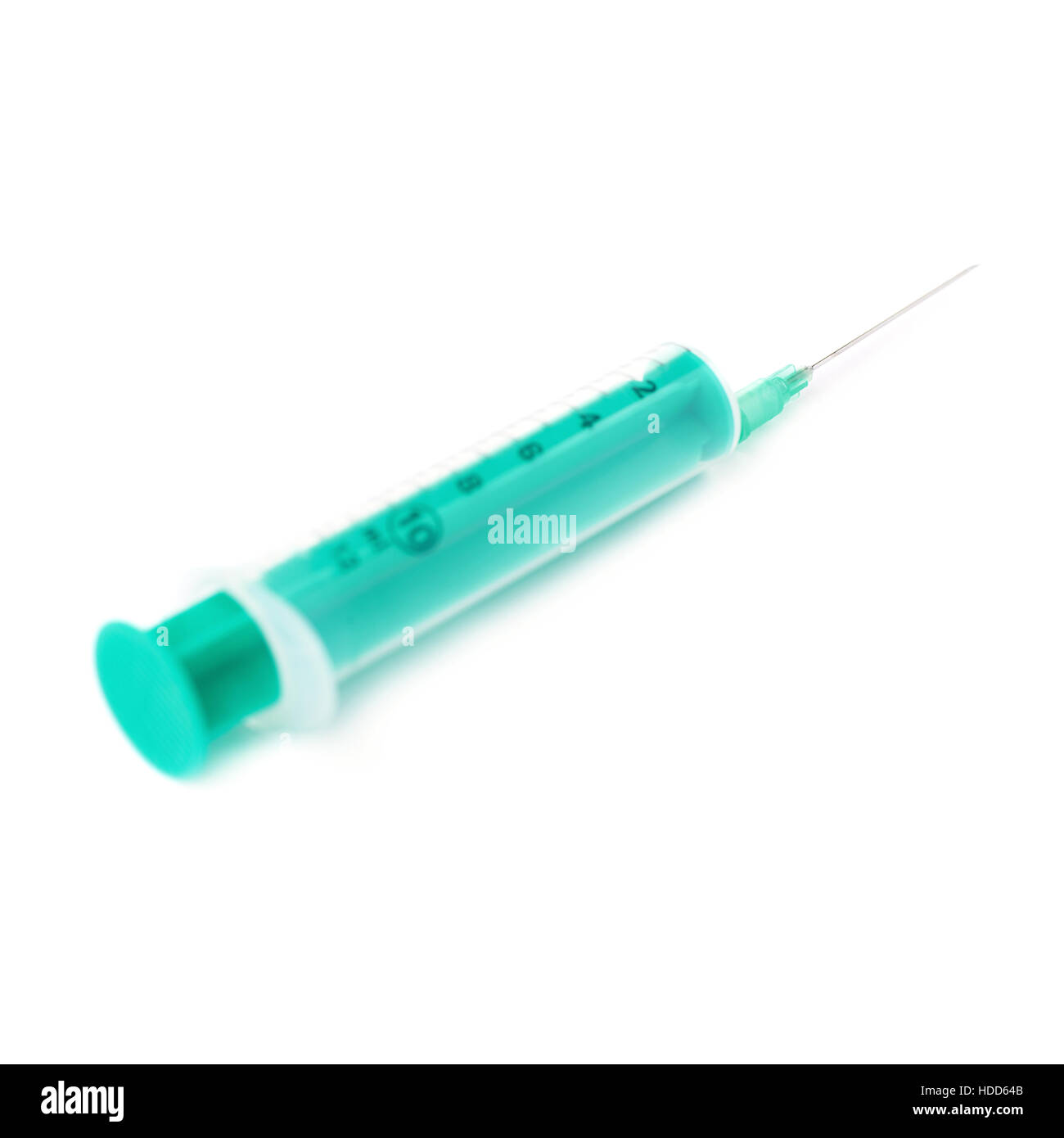 One-off green medical syringe with needle isolated over white ...