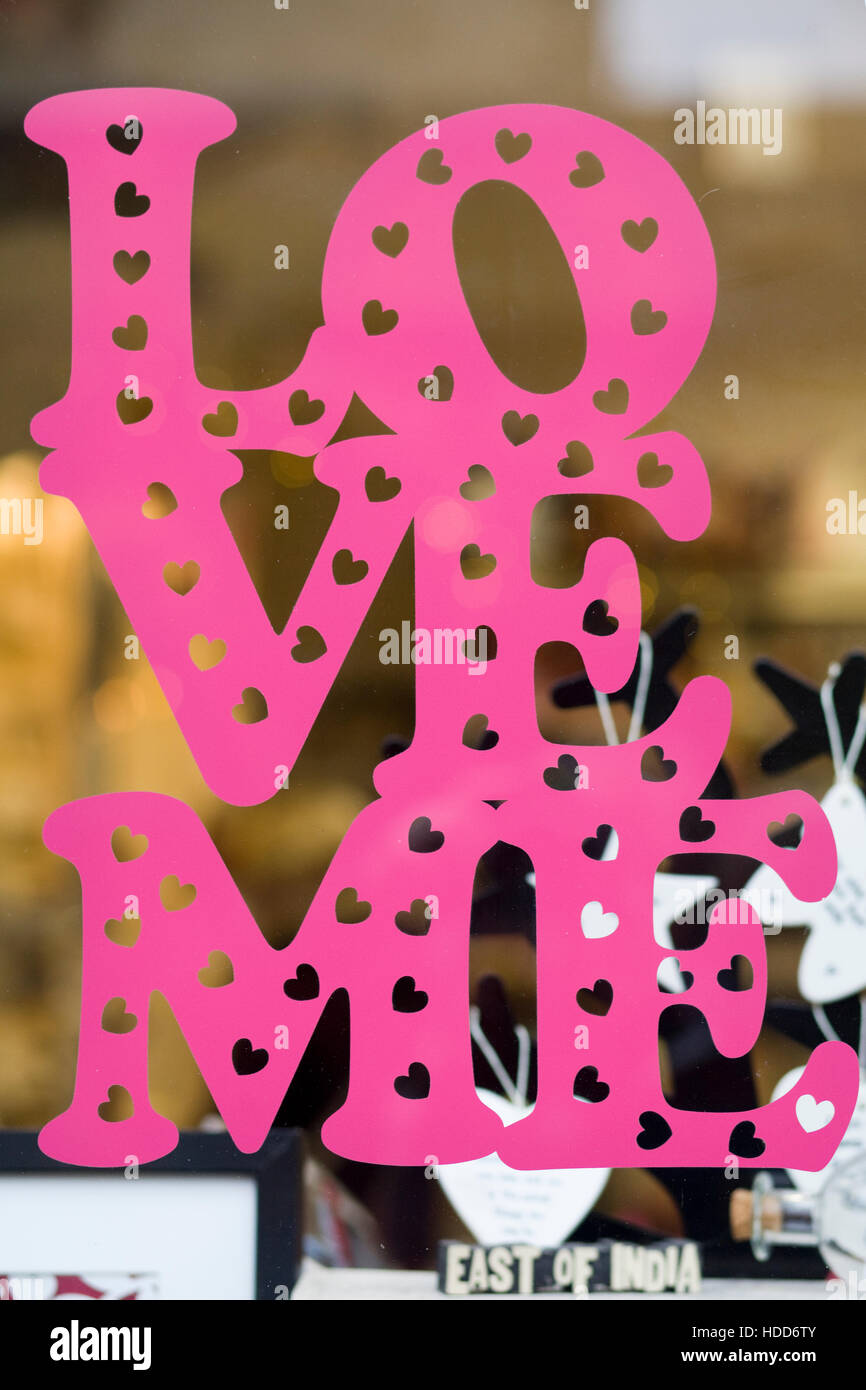 "Love me" window sticker in Pink Stock Photo - Alamy