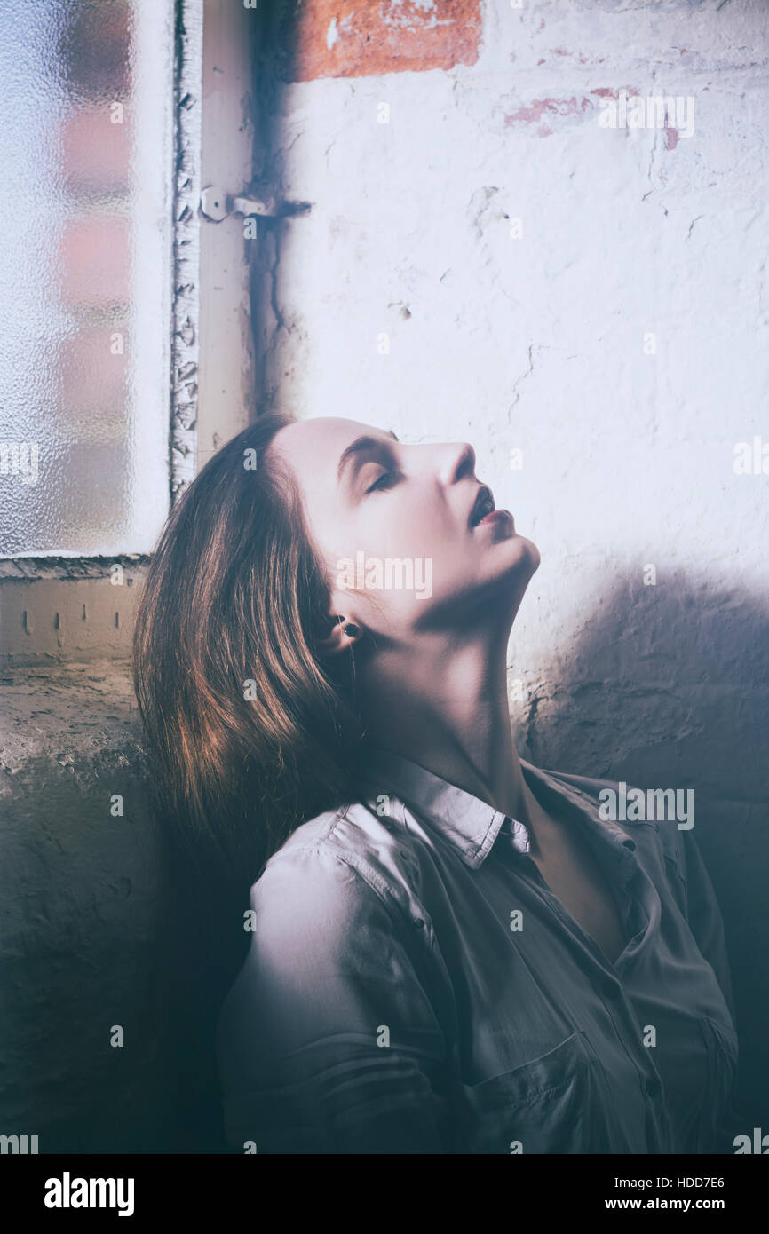 Woman leaning head against side hi-res stock photography and images - Alamy