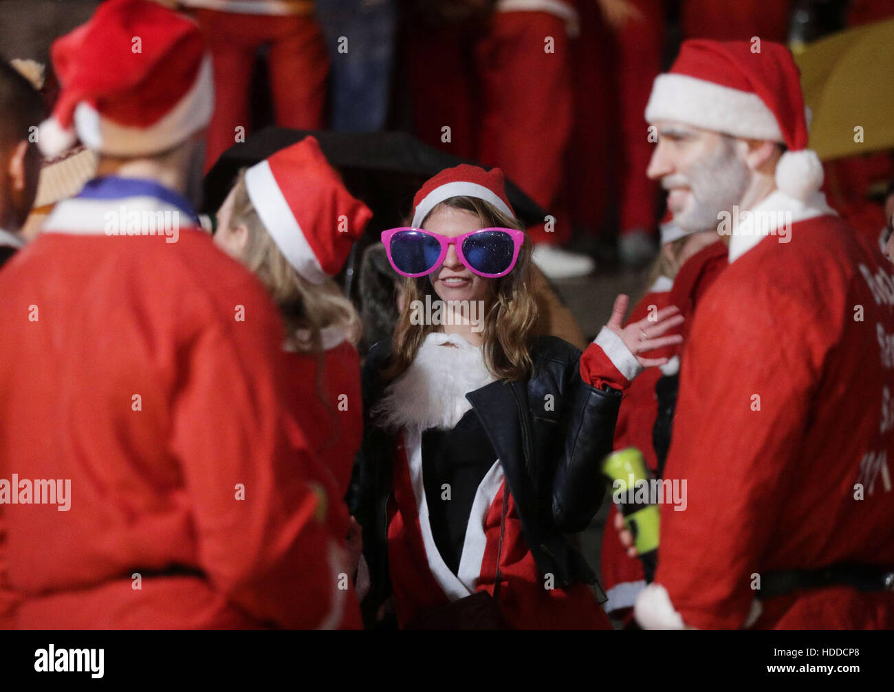 Revellers in Trafalgar Square, London, taking part in the Santacon ...