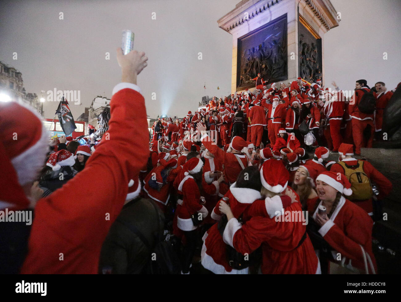 Revellers in Trafalgar Square, London, taking part in the Santacon ...