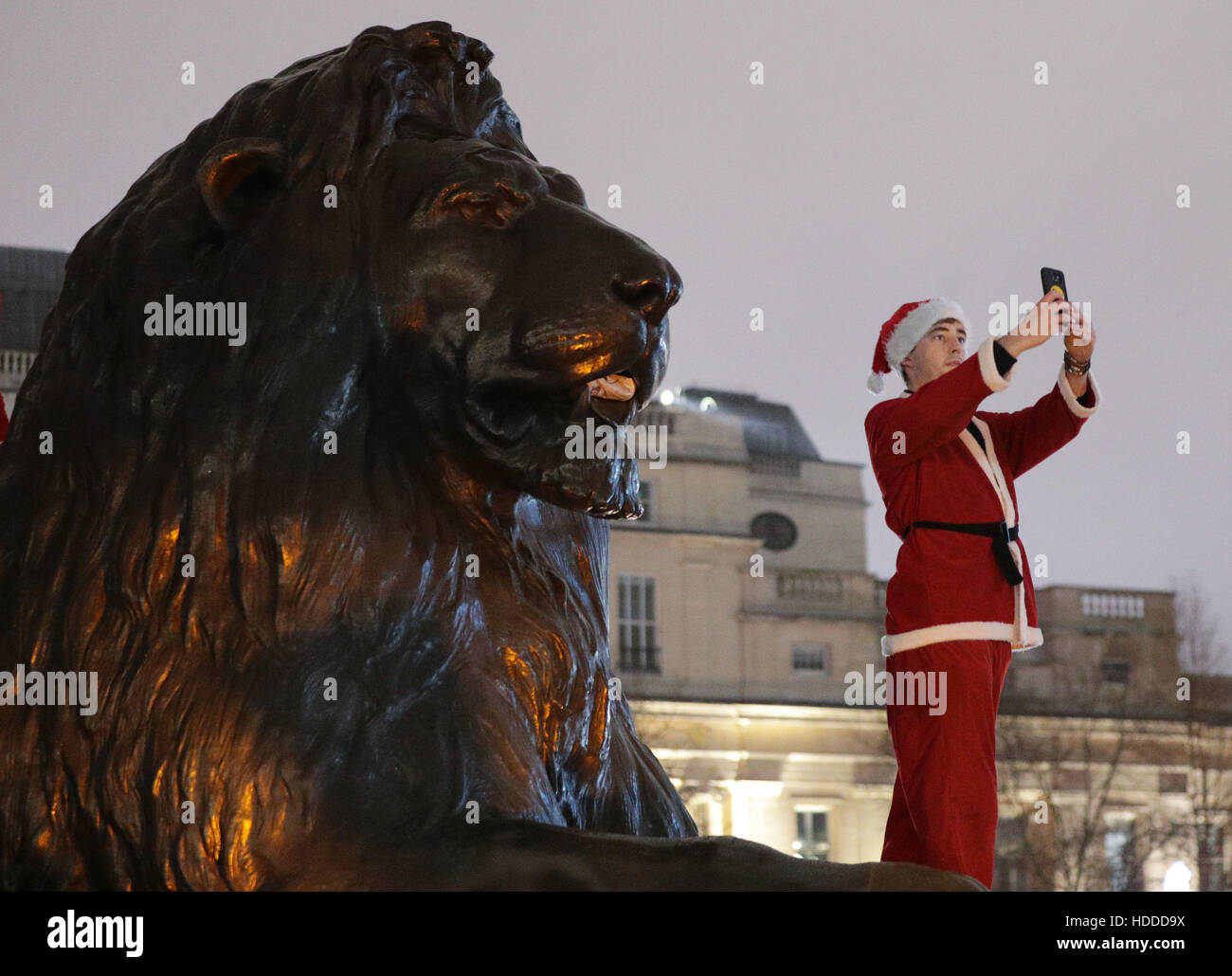 Revellers in Trafalgar Square, London, taking part in the Santacon ...