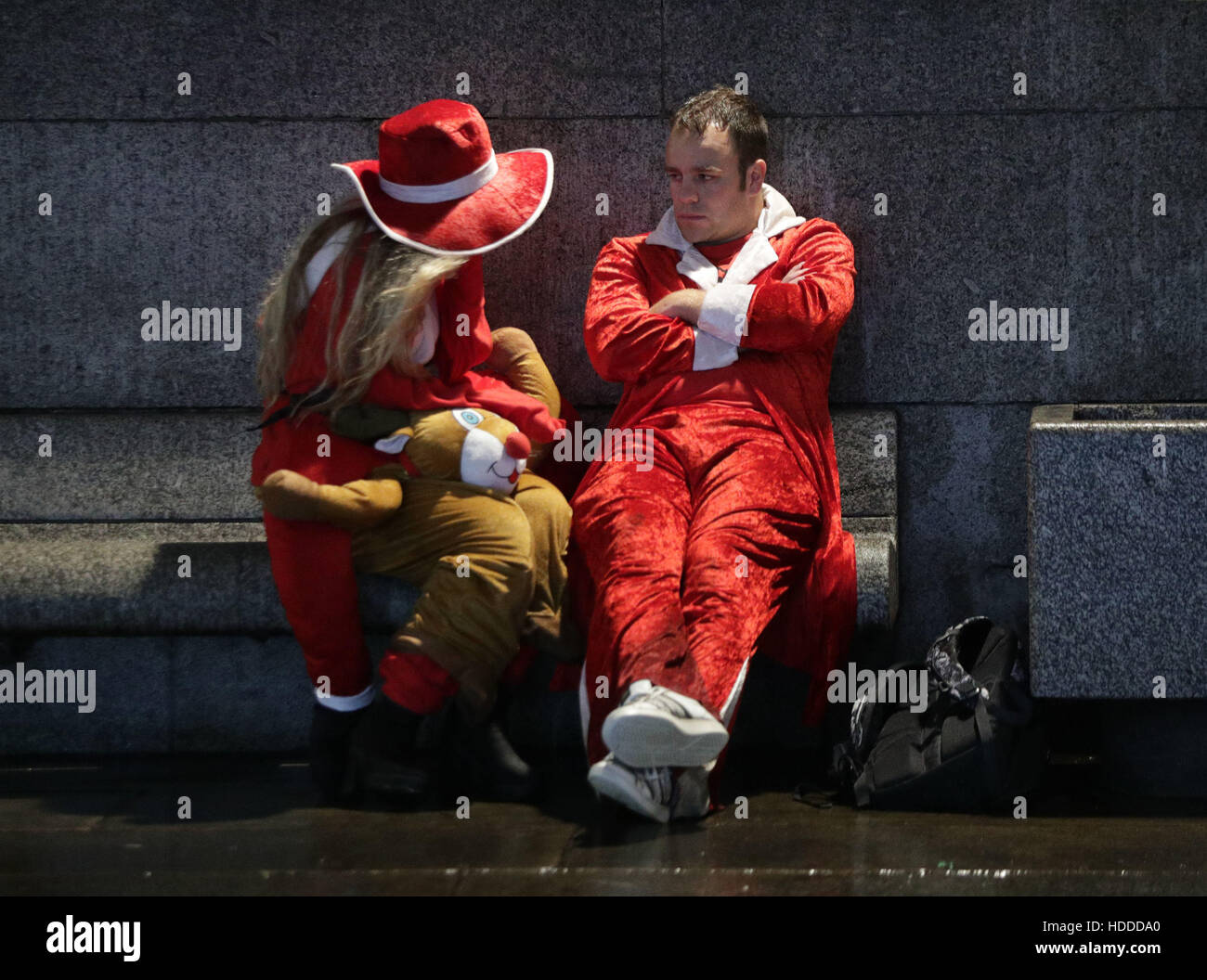Revellers in Trafalgar Square, London, taking part in the Santacon ...