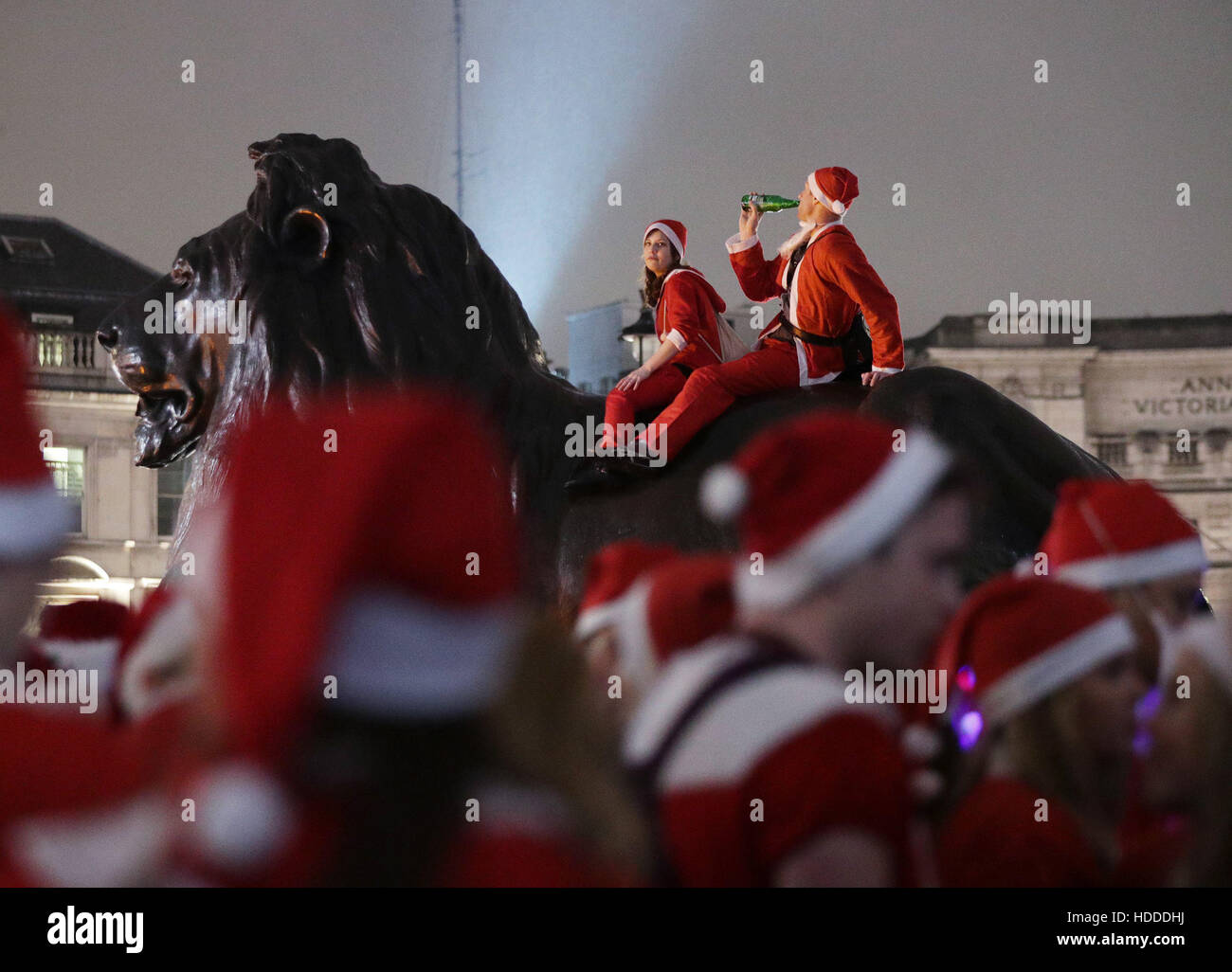 Revellers in Trafalgar Square, London, taking part in the Santacon ...