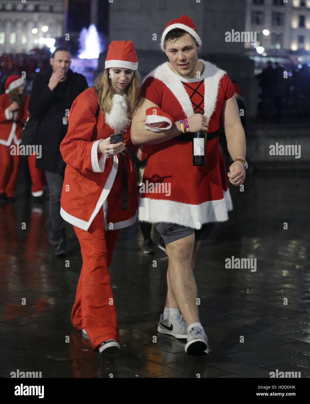 Revellers in Trafalgar Square, London, taking part in the Santacon ...
