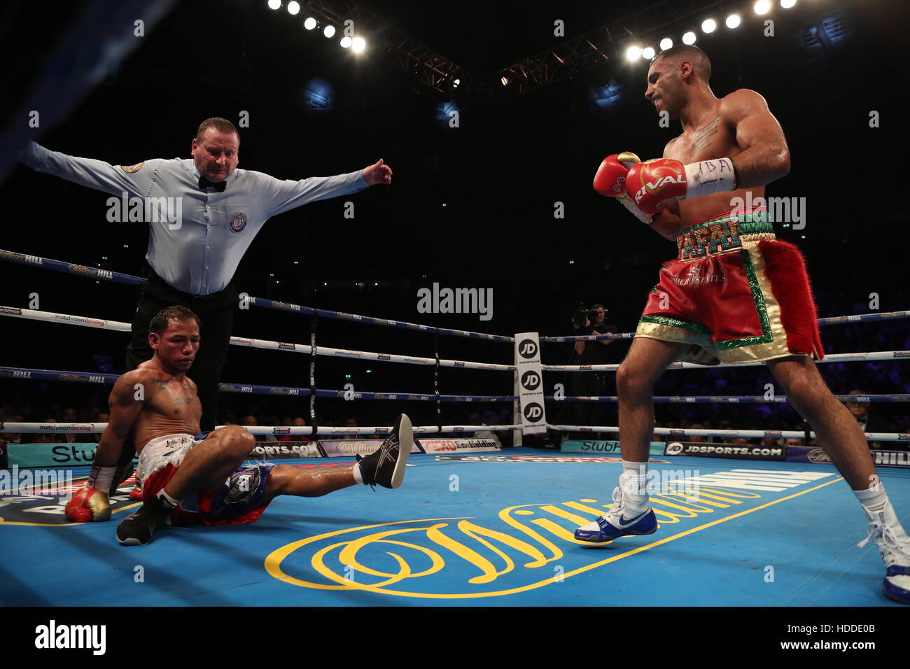 Luis Concepcion is knocked down by Kal Yafai after their Vacant WBA ...