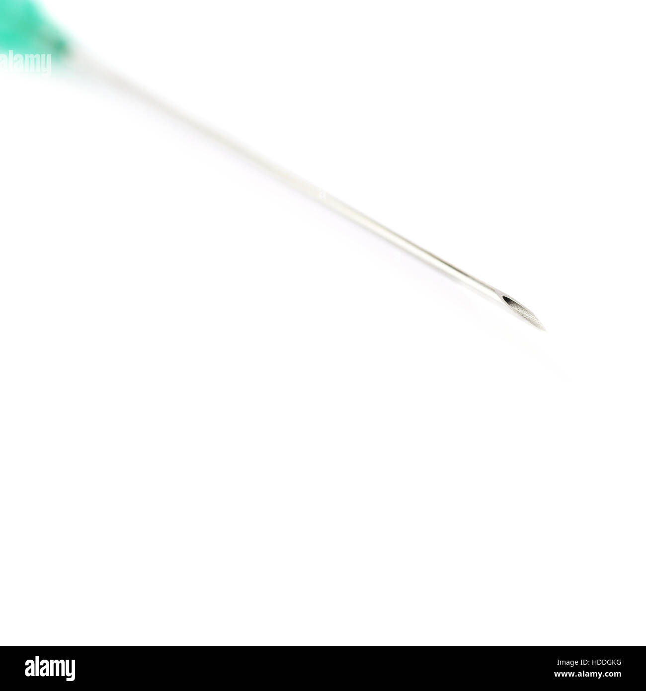 One-off green medical syringe needle isolated over white background ...