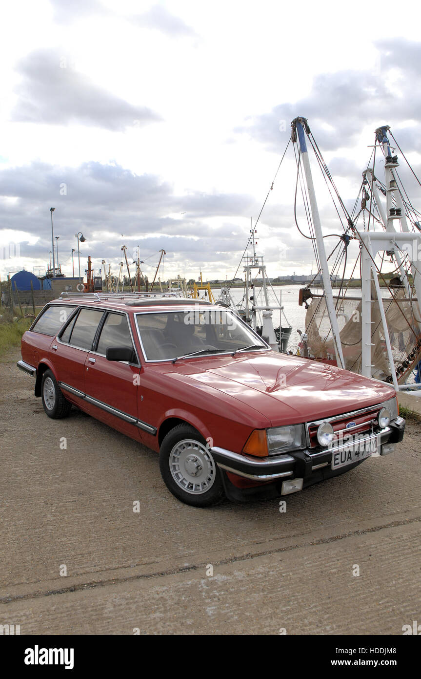 Ford Granada estate car on quayside with fishing boats behind Stock ...
