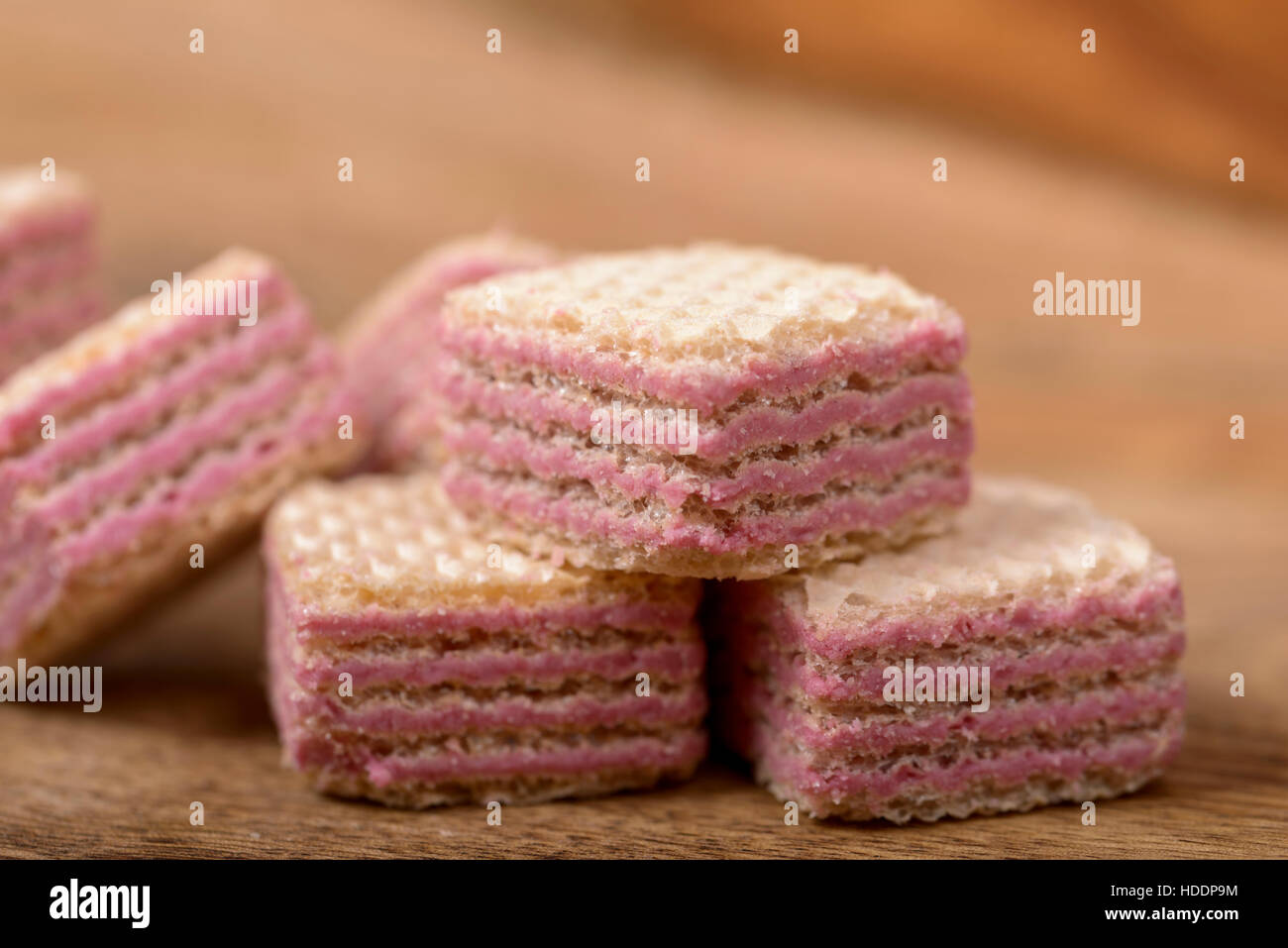 macro wafers stuffed with raspberry cream over wood Stock Photo - Alamy