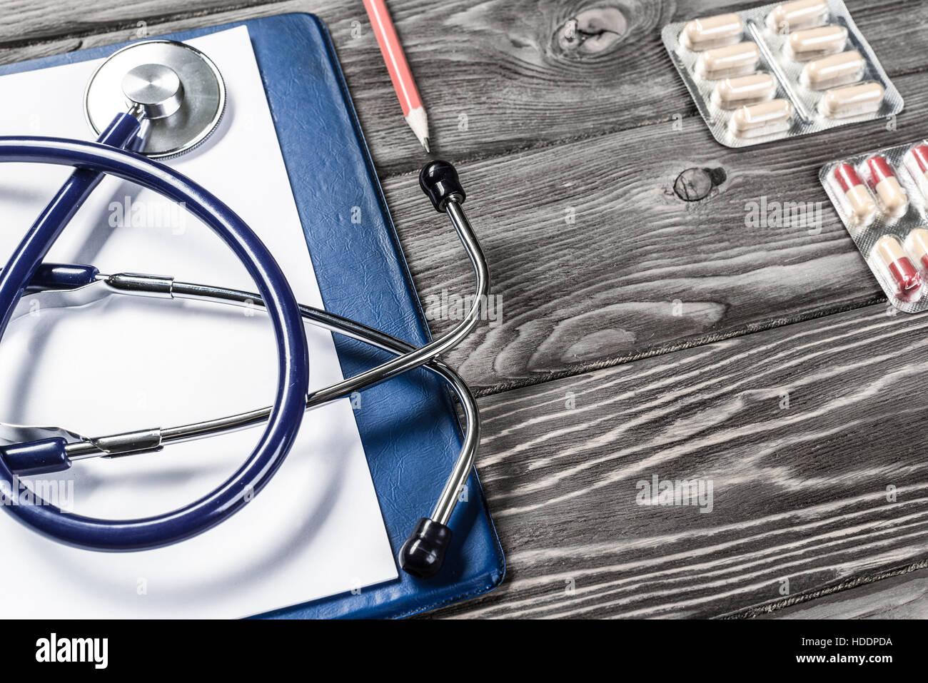 Desk of doctor with medicine things Stock Photo - Alamy