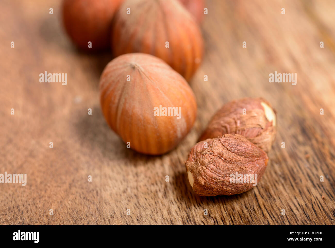 macro hazelnut and nutshell on wooden table Stock Photo - Alamy