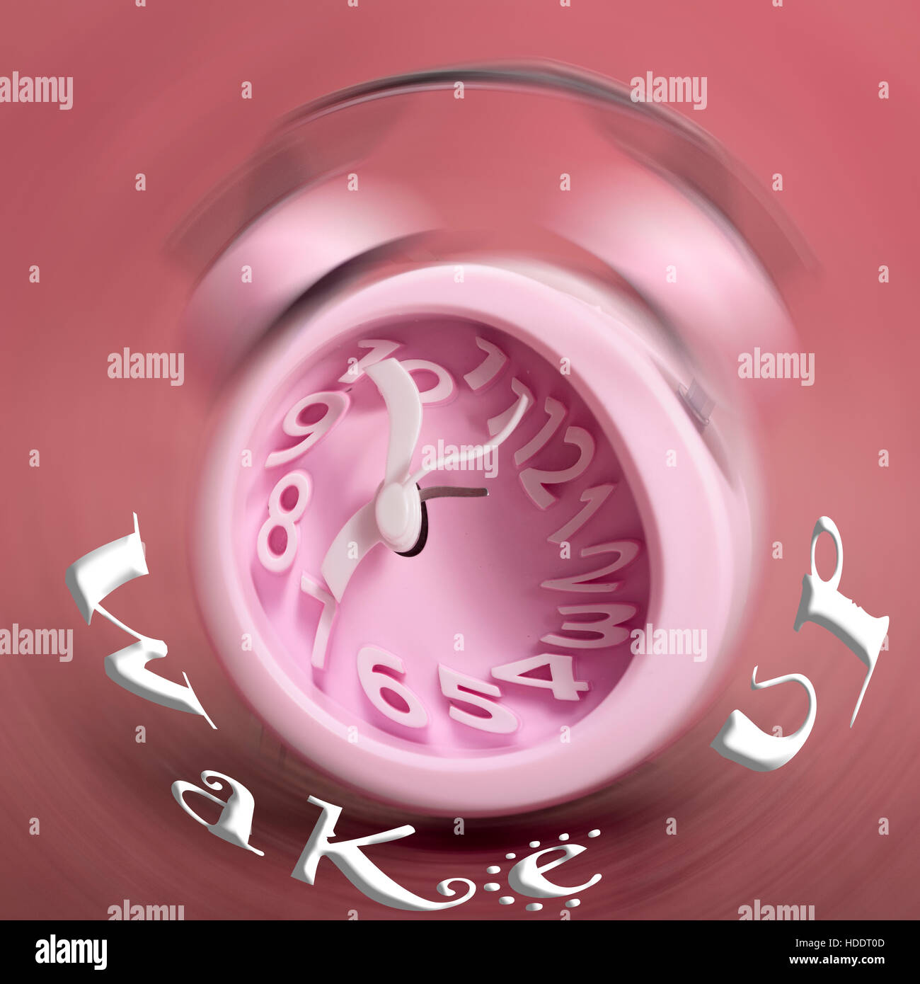 Clock Alarm set at ten to seven with wake up written Stock Photo - Alamy