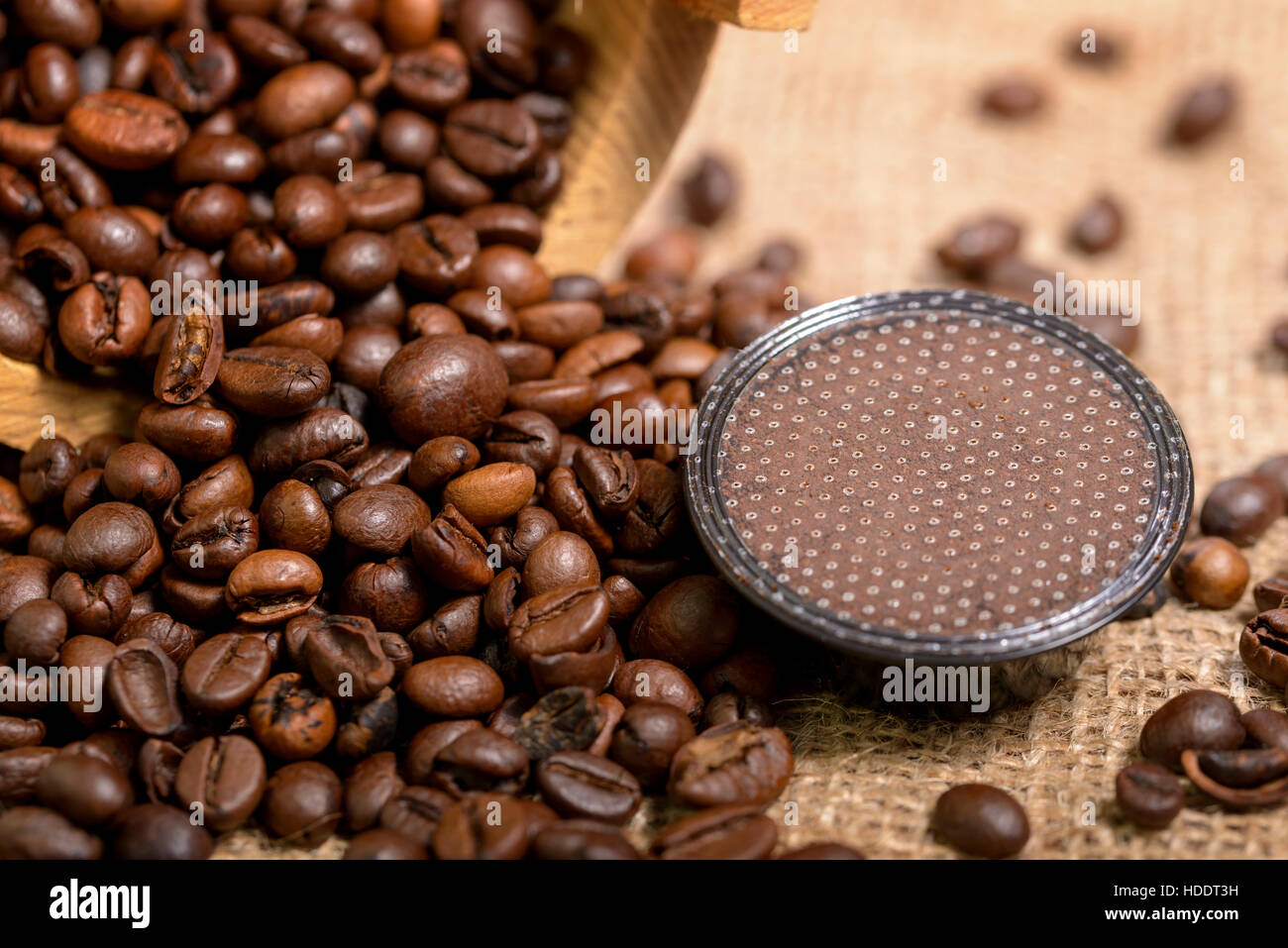 coffee capsule with coffee beans on jute Stock Photo - Alamy