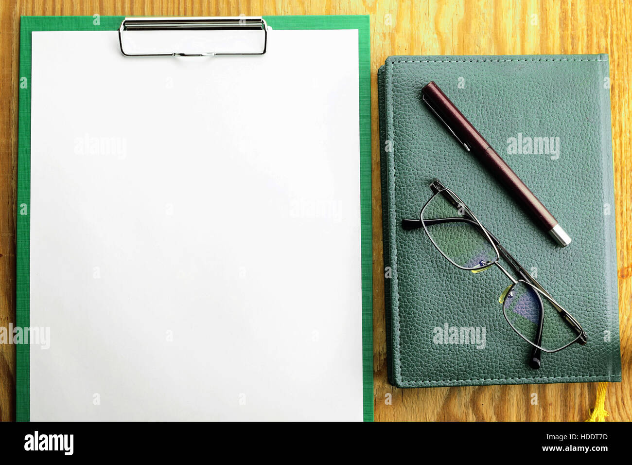 background papers and notebooks on a wooden table bright textural Stock ...
