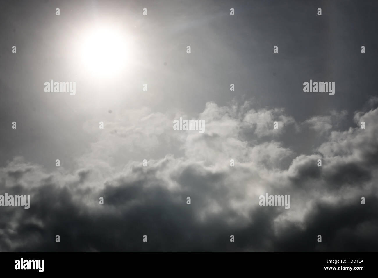 storm cloud and sun in the sky in summer day Stock Photo - Alamy