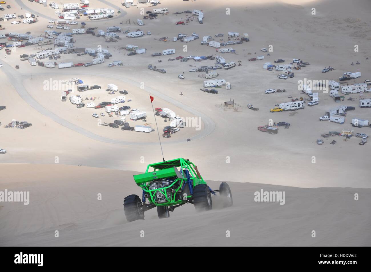 A dune buggy drives over the sand dunes at the Little Sahara Recreation ...