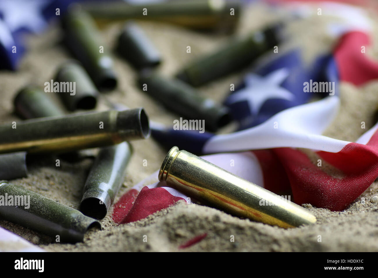 many shell casings from bullets of different caliber in the background ...