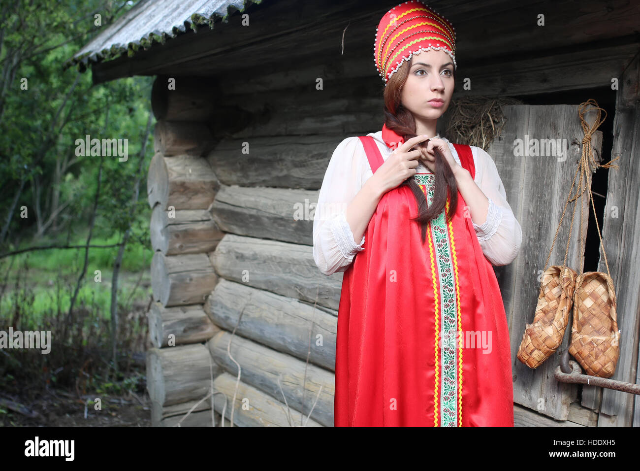 cute pretty girl in a traditional Slavic dress on nature in an unspoilt ...