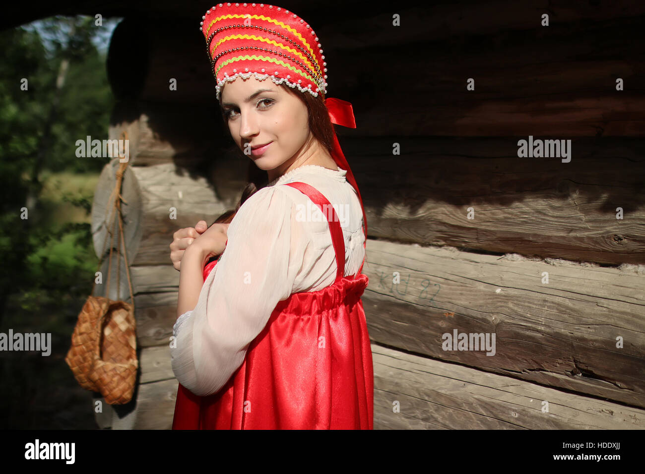 cute pretty girl in a traditional Slavic dress on nature in an unspoilt ...