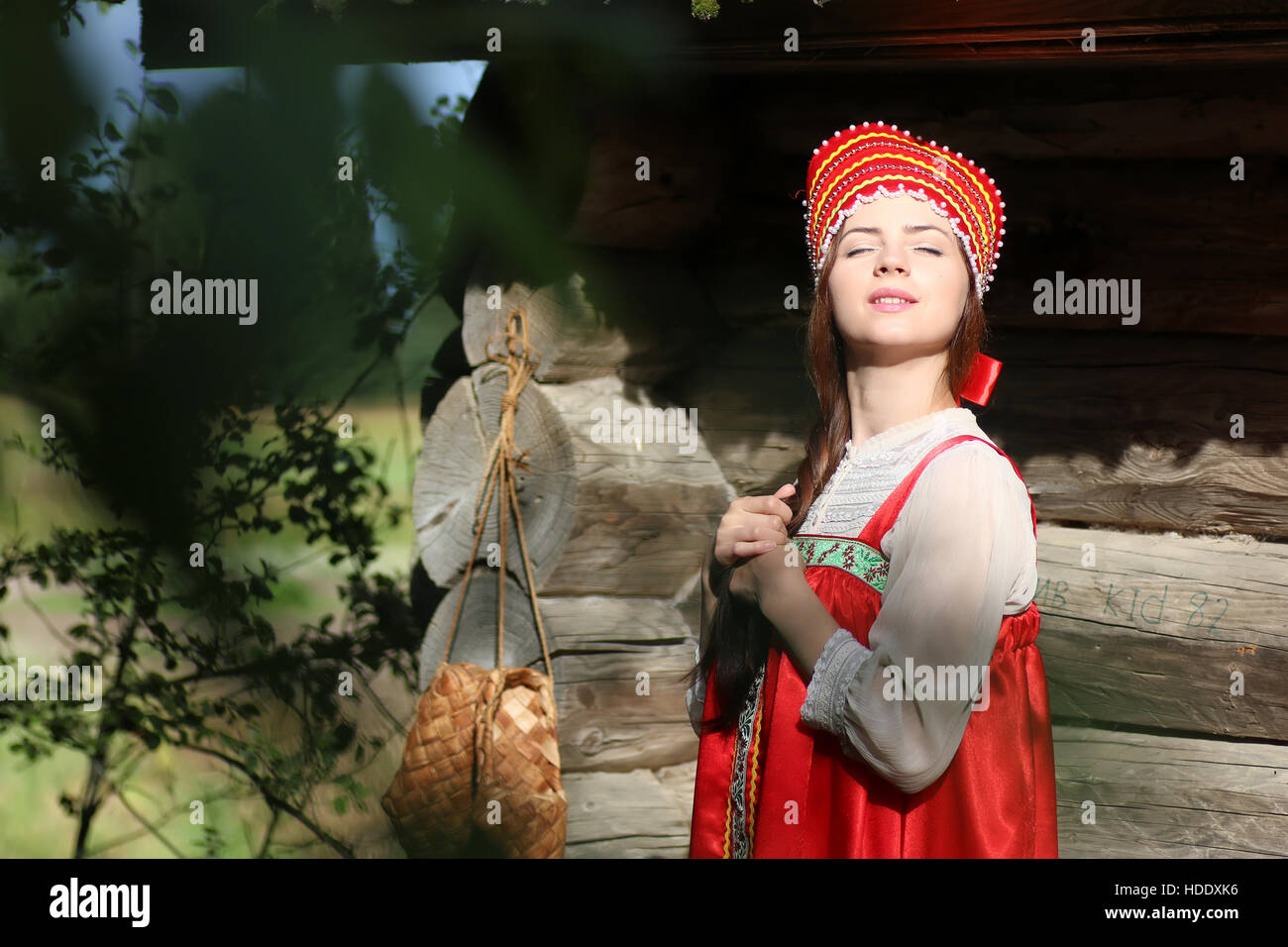 cute pretty girl in a traditional Slavic dress on nature in an unspoilt ...