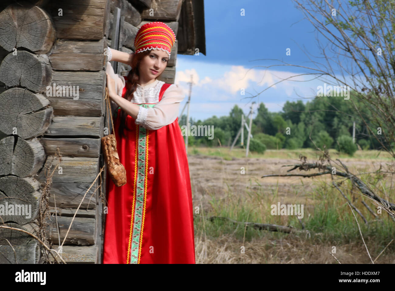 cute pretty girl in a traditional Slavic dress on nature in an unspoilt ...