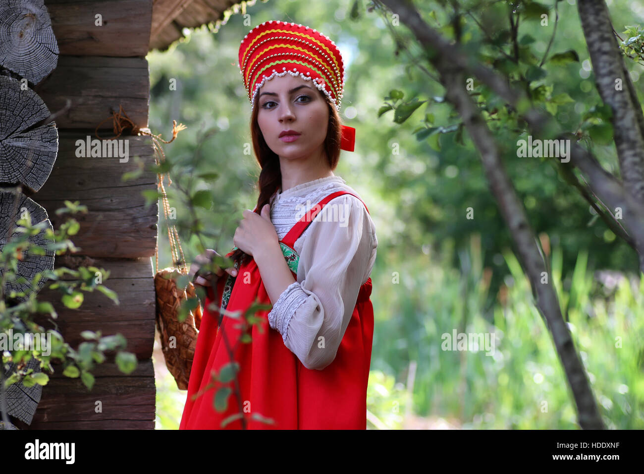 cute pretty girl in a traditional Slavic dress on nature in an unspoilt ...