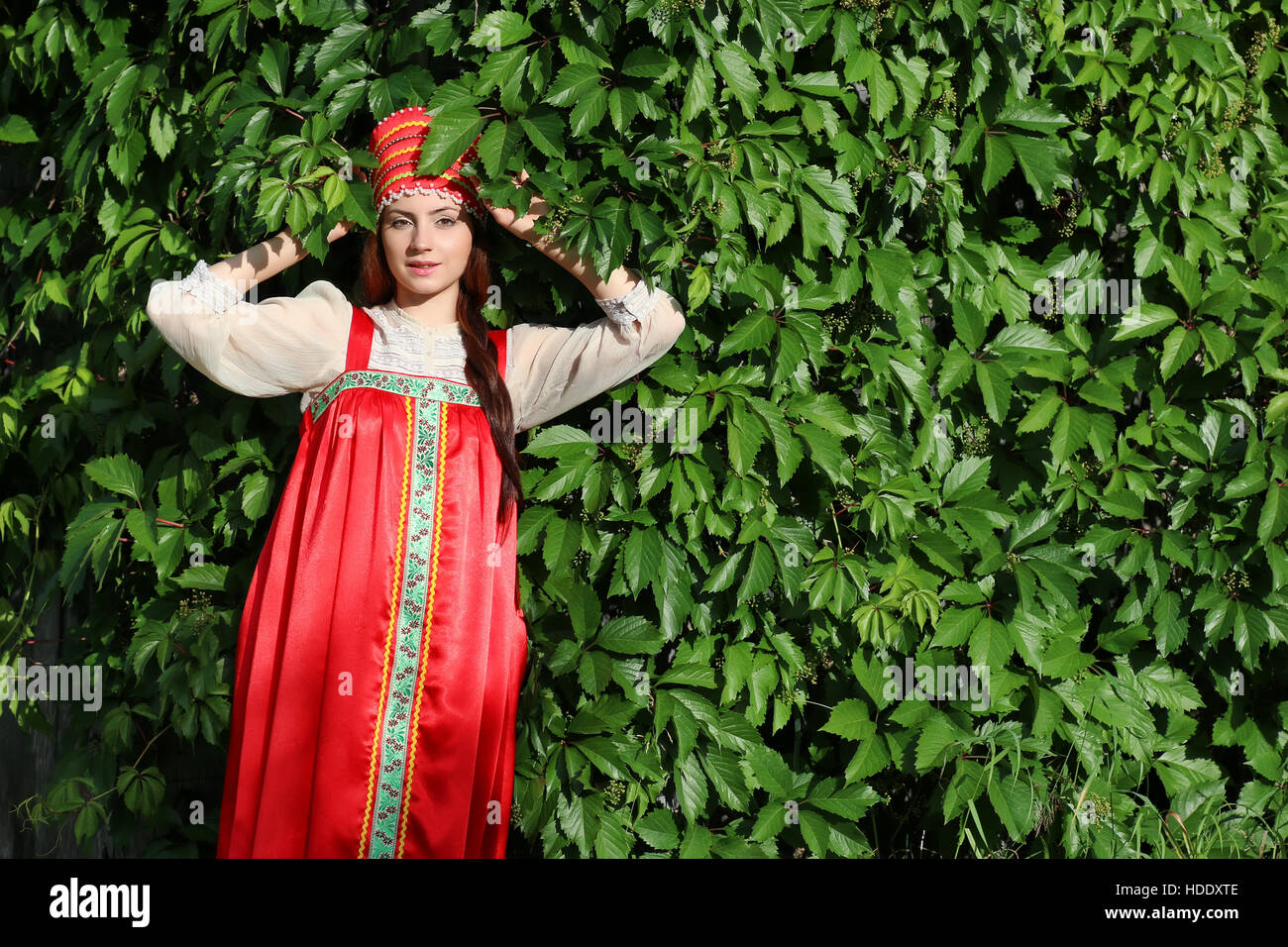 cute pretty girl in a traditional Slavic dress on nature in an unspoilt ...