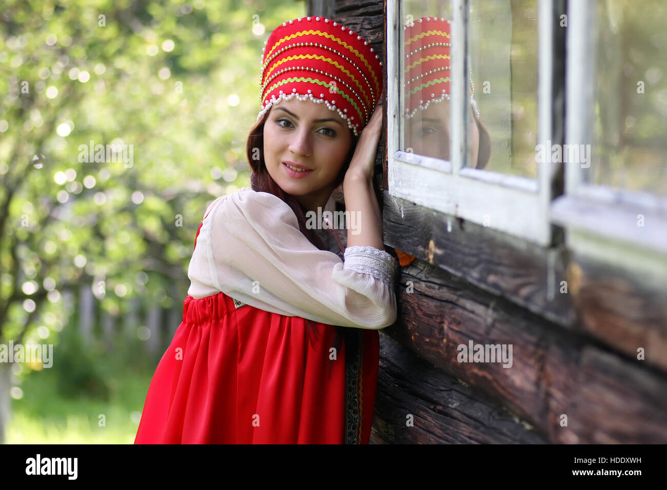 cute pretty girl in a traditional Slavic dress on nature in an unspoilt ...
