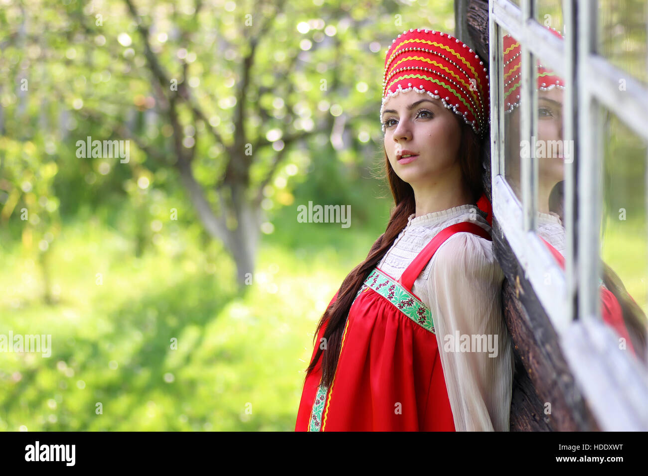 cute pretty girl in a traditional Slavic dress on nature in an unspoilt ...