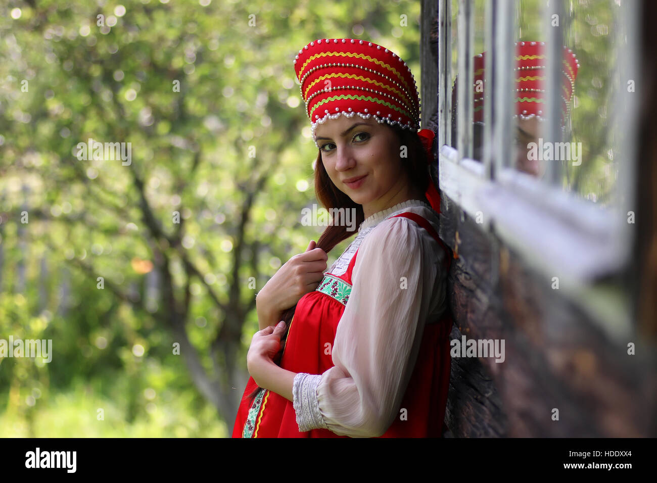 cute pretty girl in a traditional Slavic dress on nature in an unspoilt ...