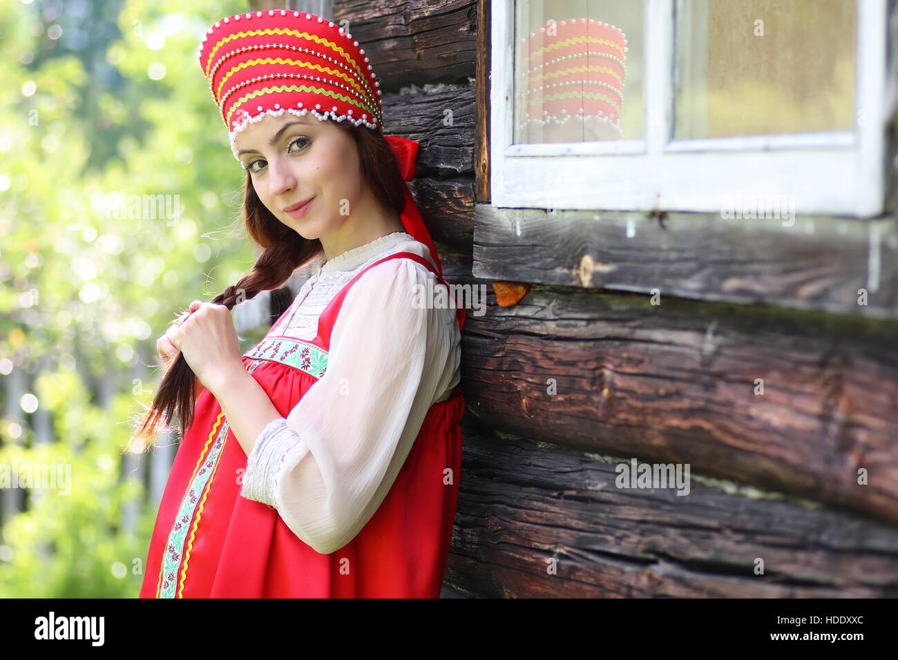 cute pretty girl in a traditional Slavic dress on nature in an unspoilt ...