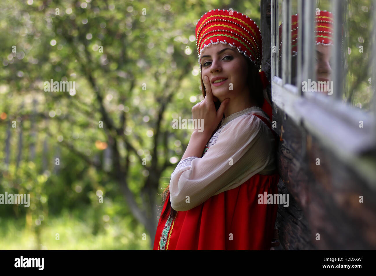cute pretty girl in a traditional Slavic dress on nature in an unspoilt ...