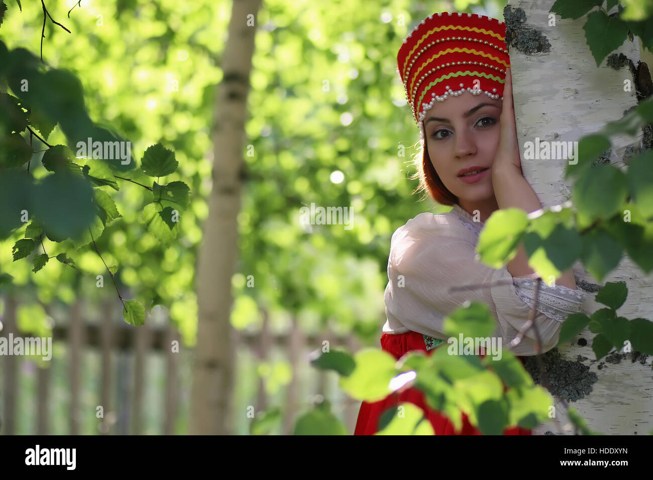 cute pretty girl in a traditional Slavic dress on nature in an unspoilt ...