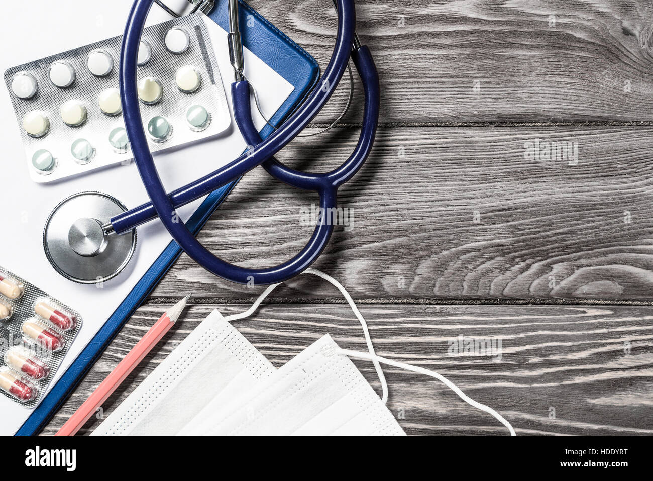 Desk of doctor with medicine things Stock Photo - Alamy